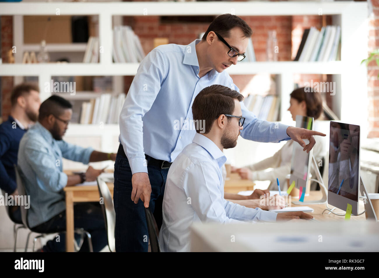 Colleague coaching hi-res stock photography and images - Alamy