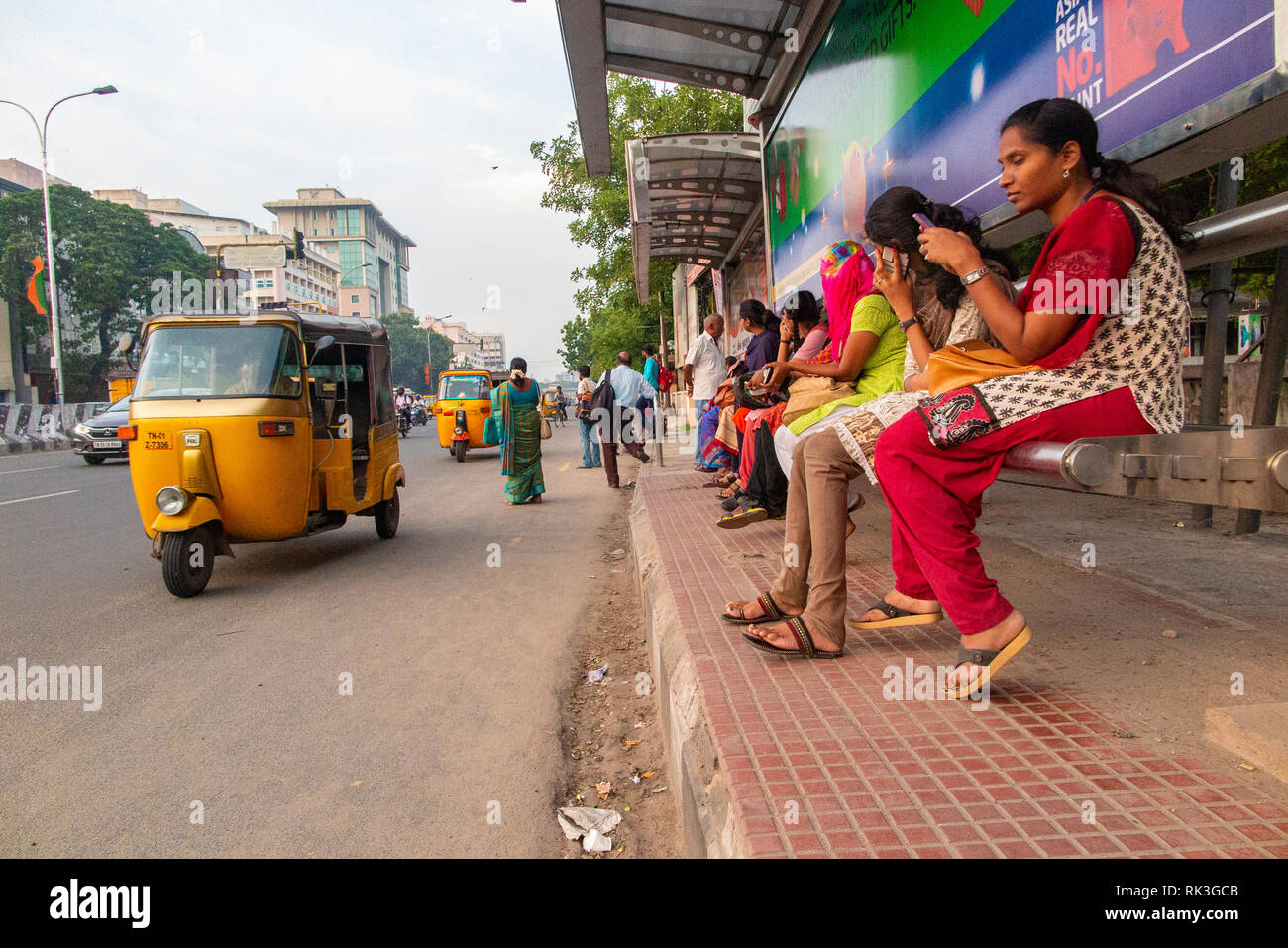 Evening rush hour with lots of motorbikes and a tuk tuk in Chennai ...