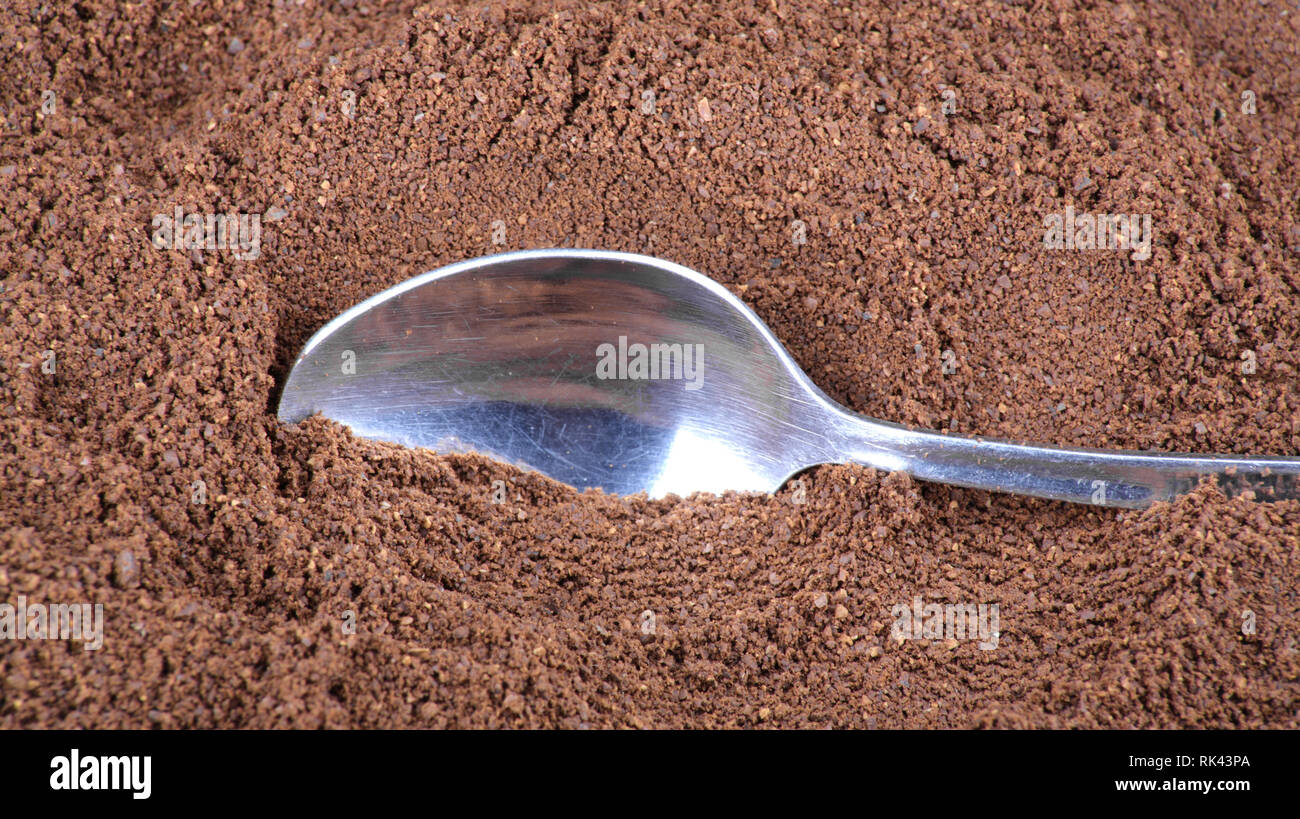 milled coffee background and teaspoon Stock Photo - Alamy