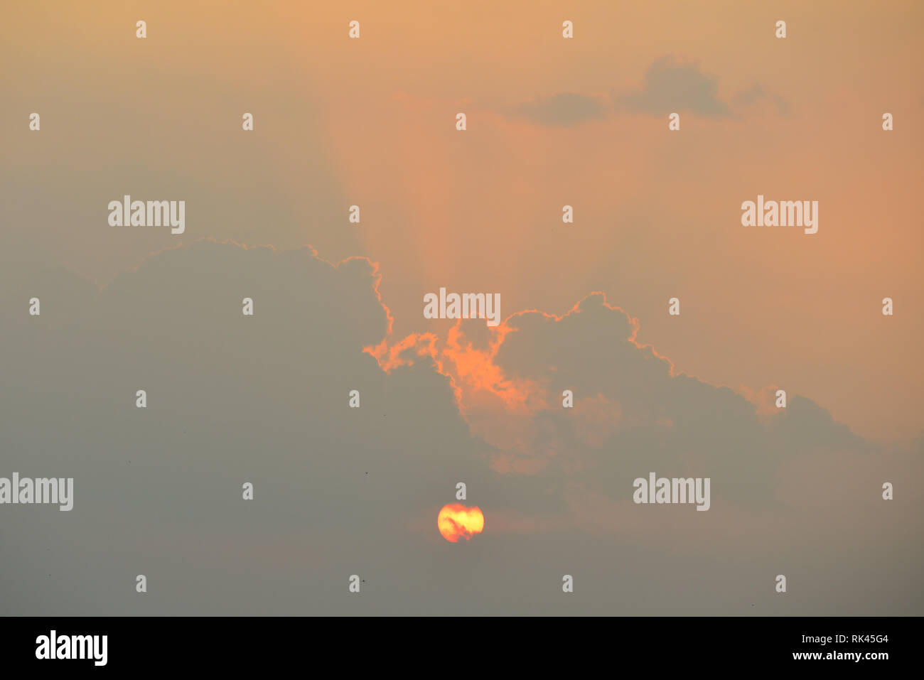 Sunset in the yellow sky with clouds. Nature background Stock Photo - Alamy
