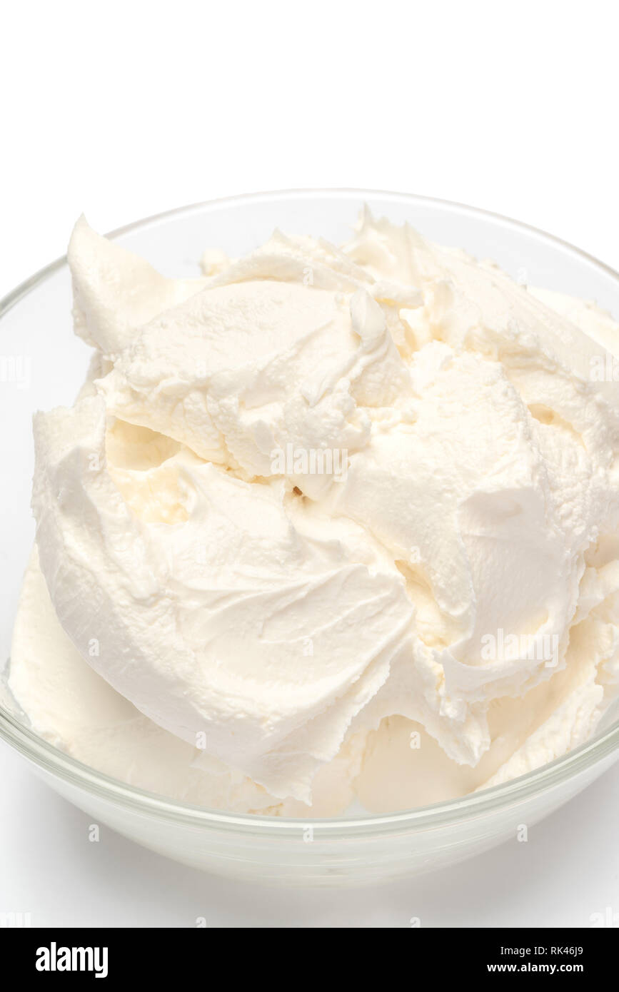 Traditional Mascarpone cheese in glass bowl isolated on white Stock ...