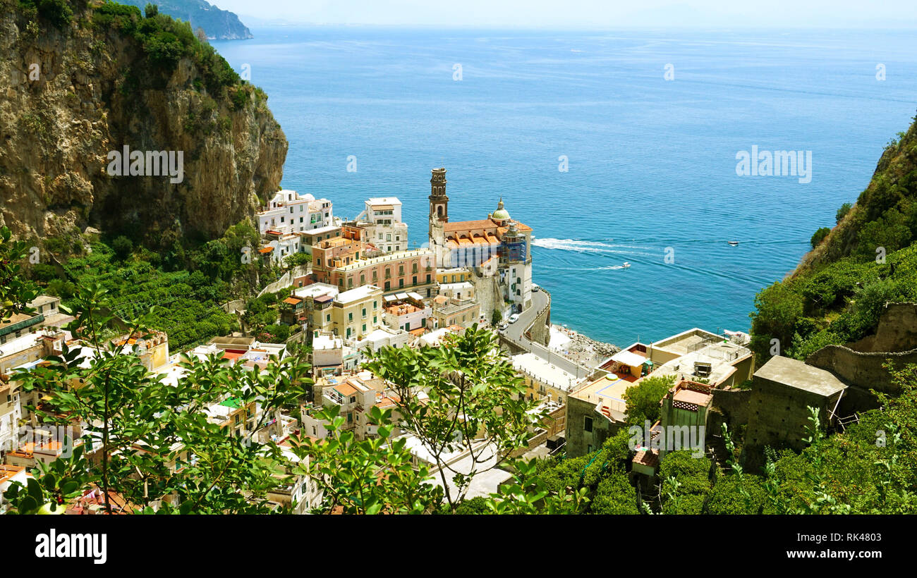 Beautiful aerial view of Atrani village between green branches and ...