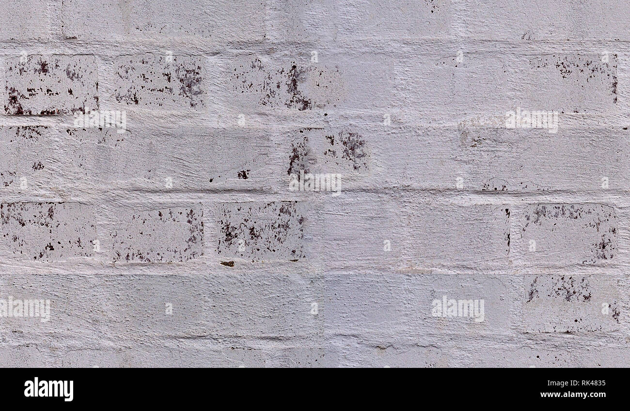 close-up of a facade of bricks and mortar painted white as seamless ...