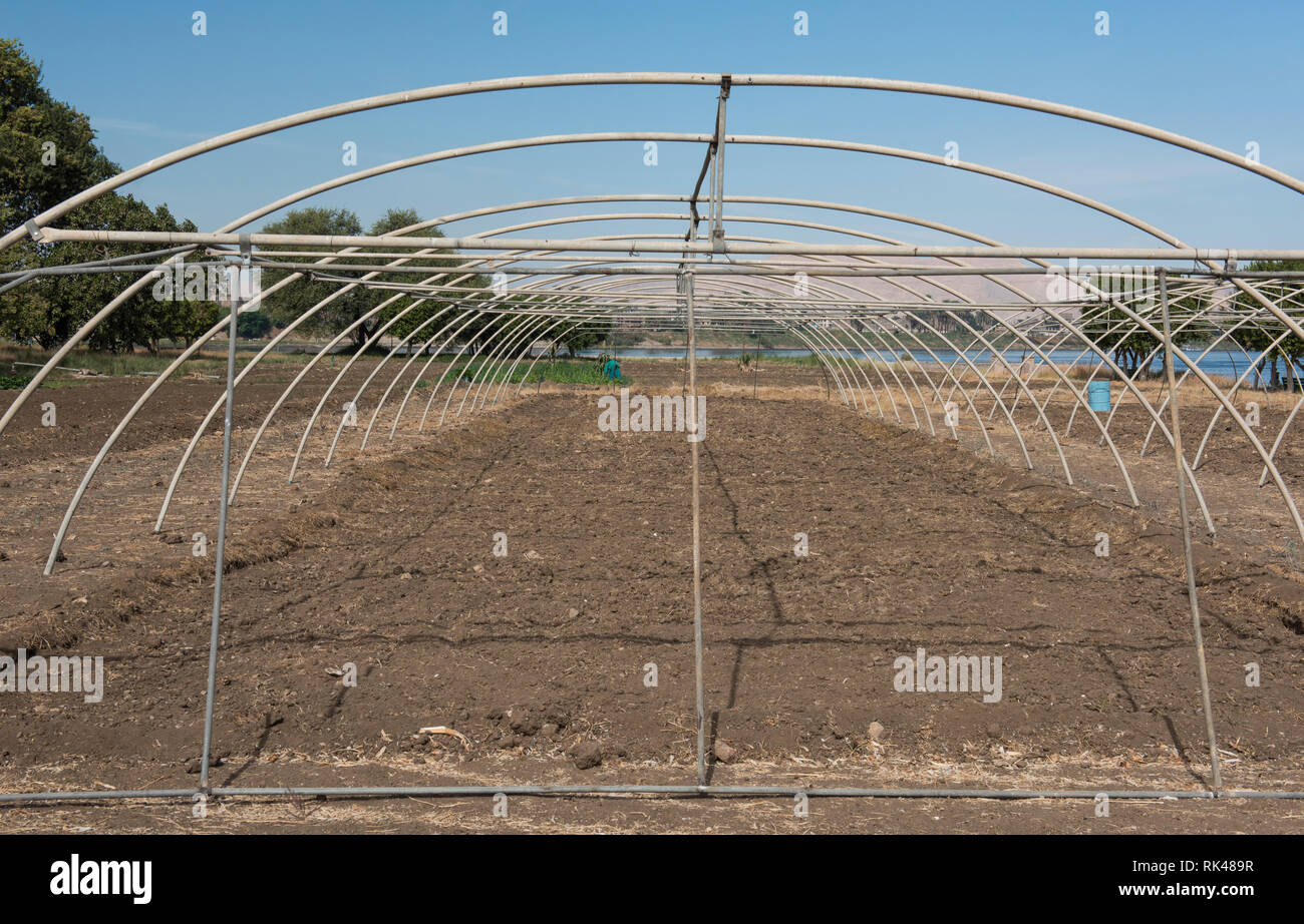 Greenhouse frames in arable farmland field rural countryside setting ...