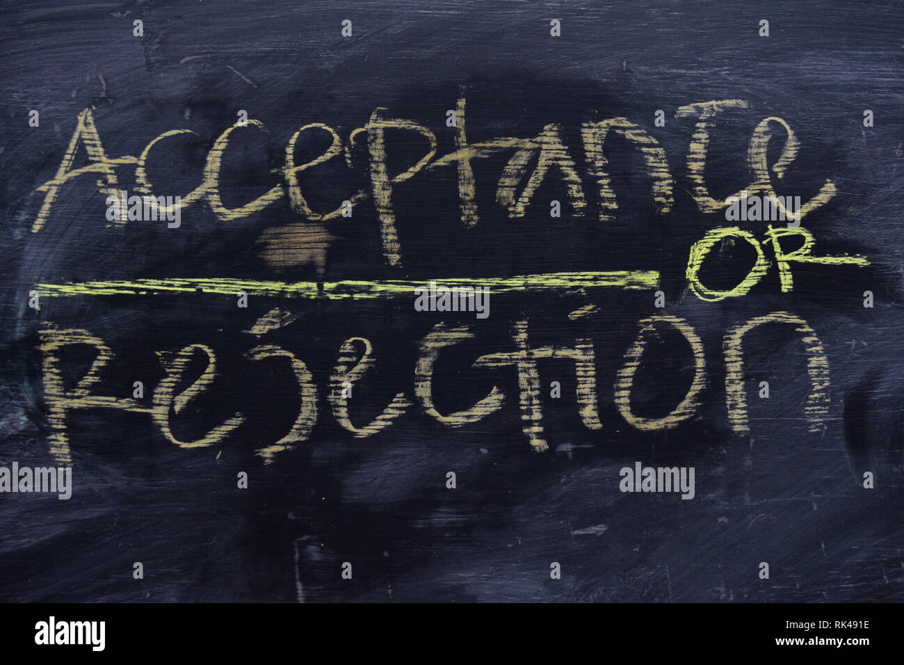 Acceptance or Rejection written with color chalk concept on the ...