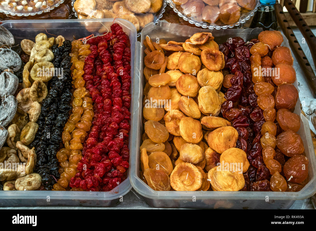 Exhibited in plastic trays candied apricots, peaches, figs,prunes ...