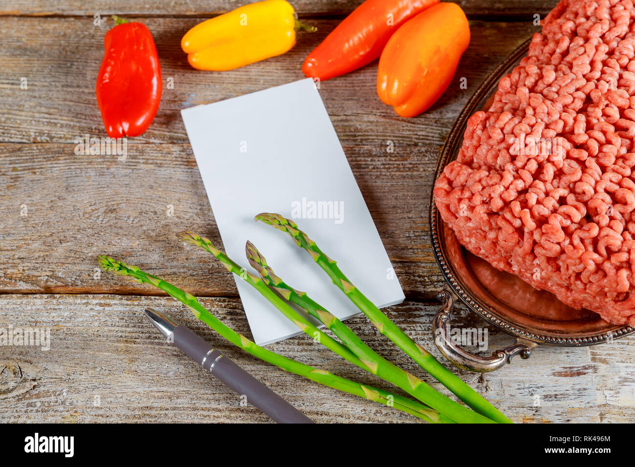Beef minced with spices and vegetables, colorful peppers and asparagus ...