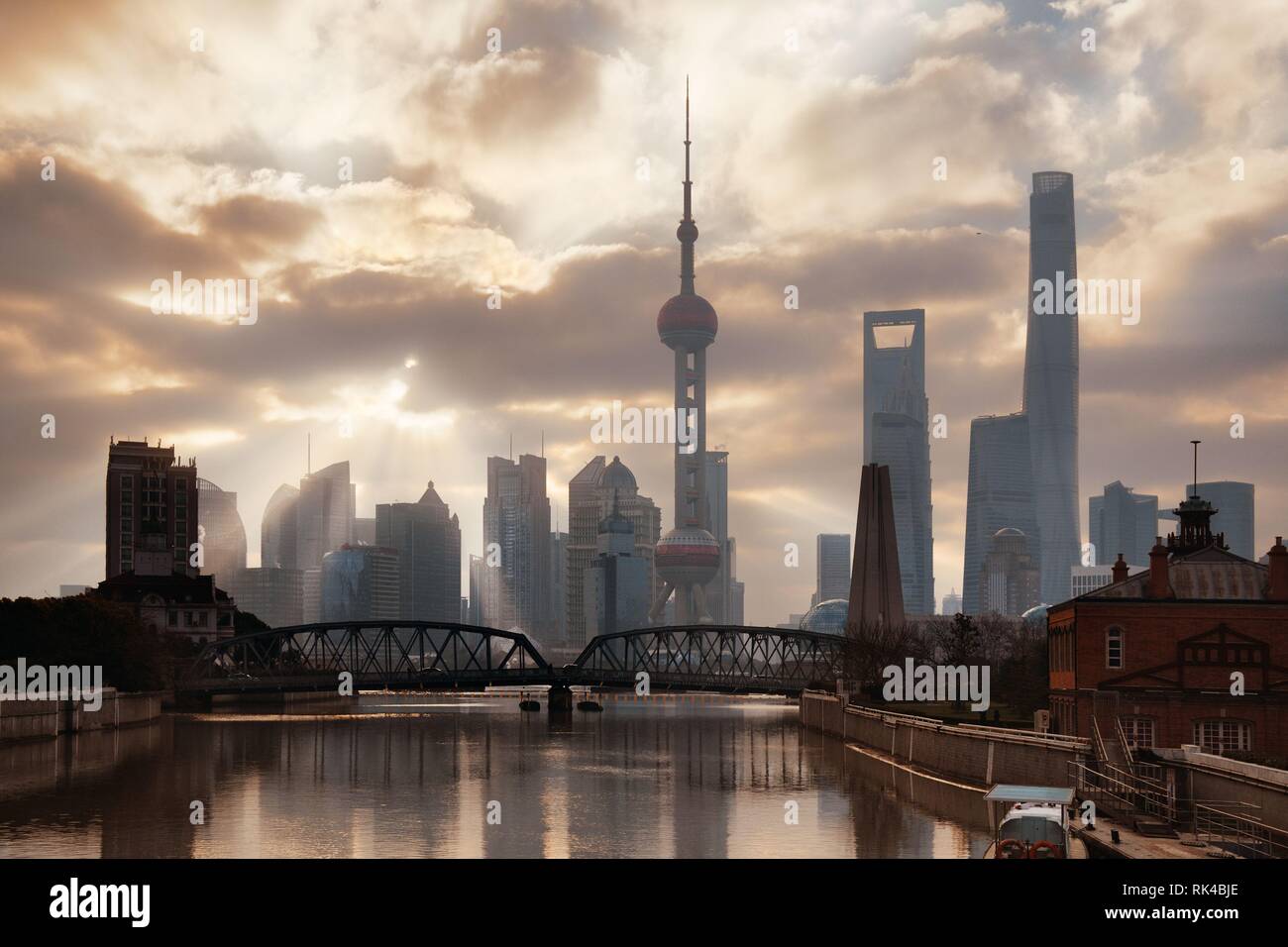 Shanghai morning with sunny sky and water reflections in China Stock ...