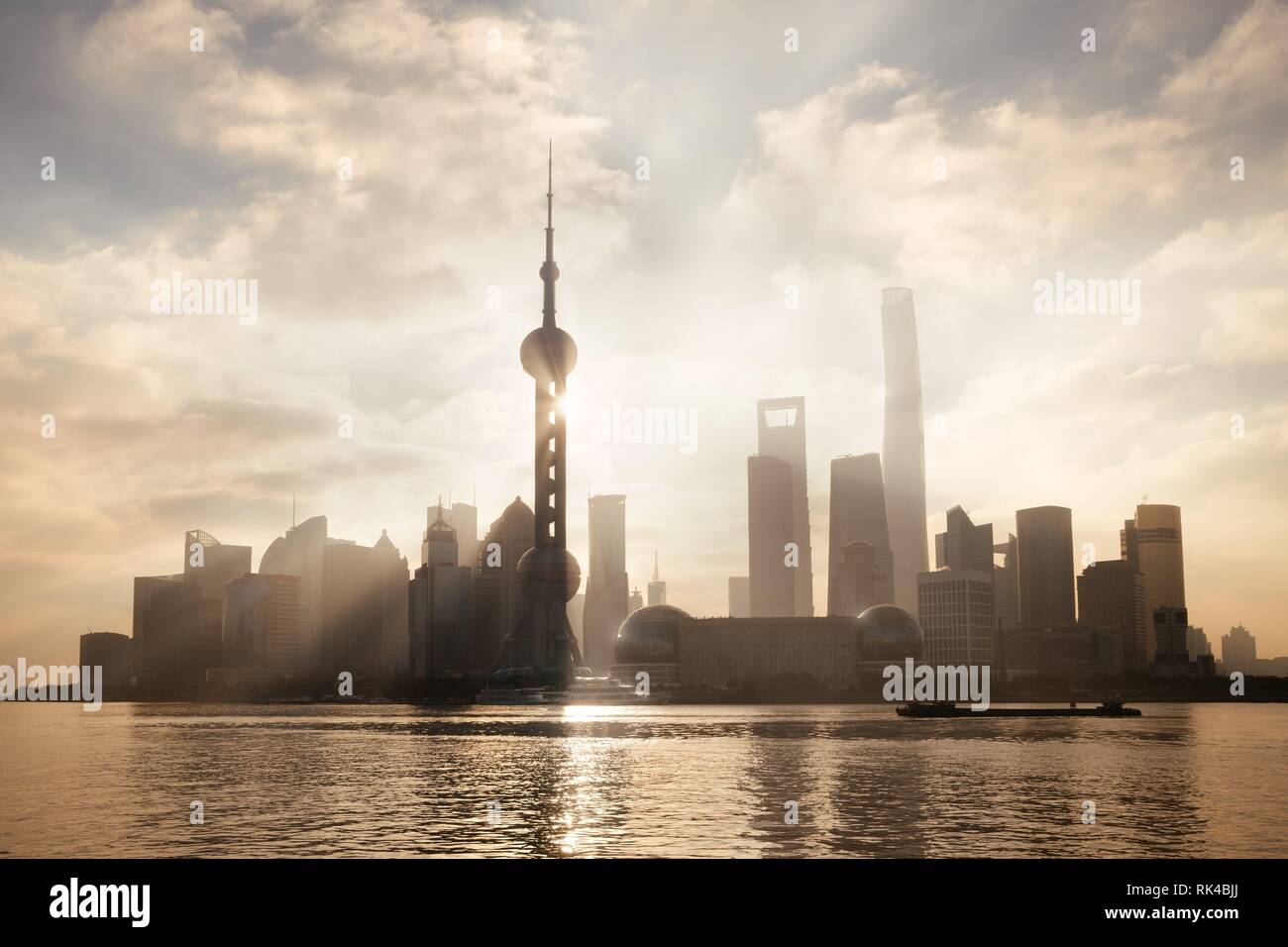 Shanghai morning with sunny sky and water reflections in China Stock ...