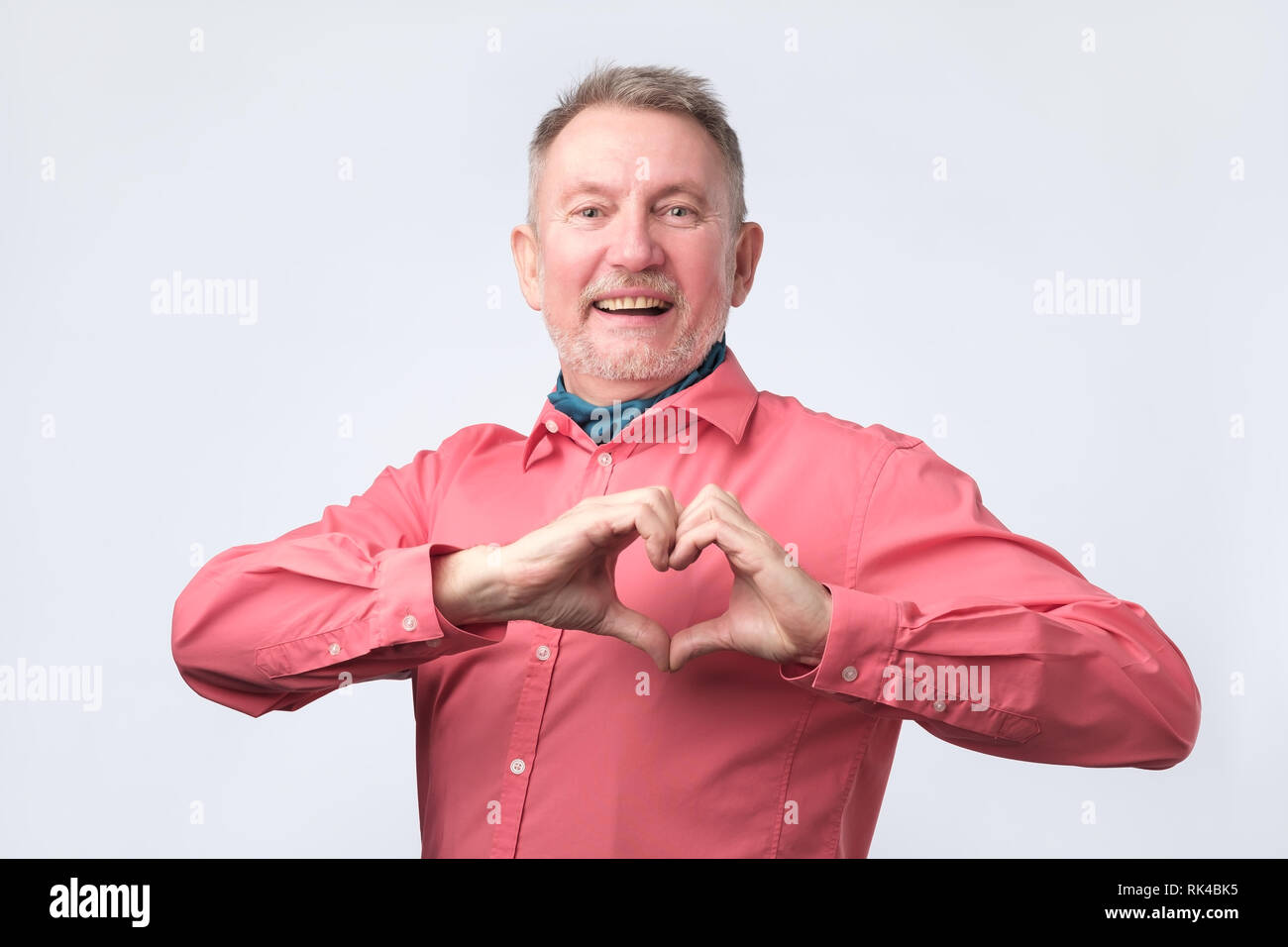 Handsome guy showing heart man hi-res stock photography and images - Alamy