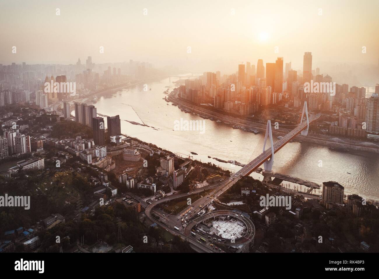 Aerial view of urban buildings and city skyline in Chongqing at sunset ...