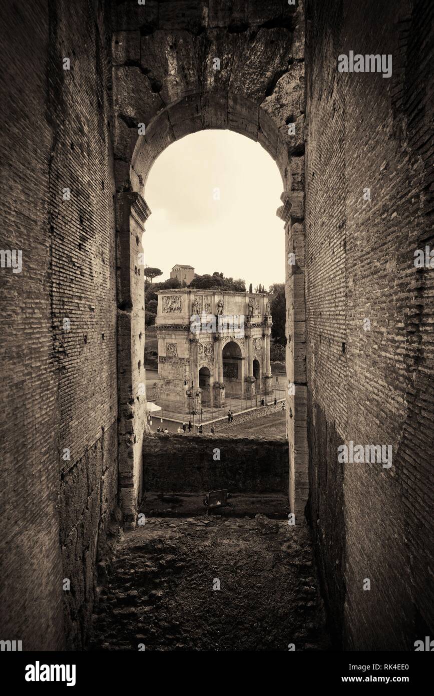 Archway in Colosseum with Arch of Constantine, the world known landmark ...
