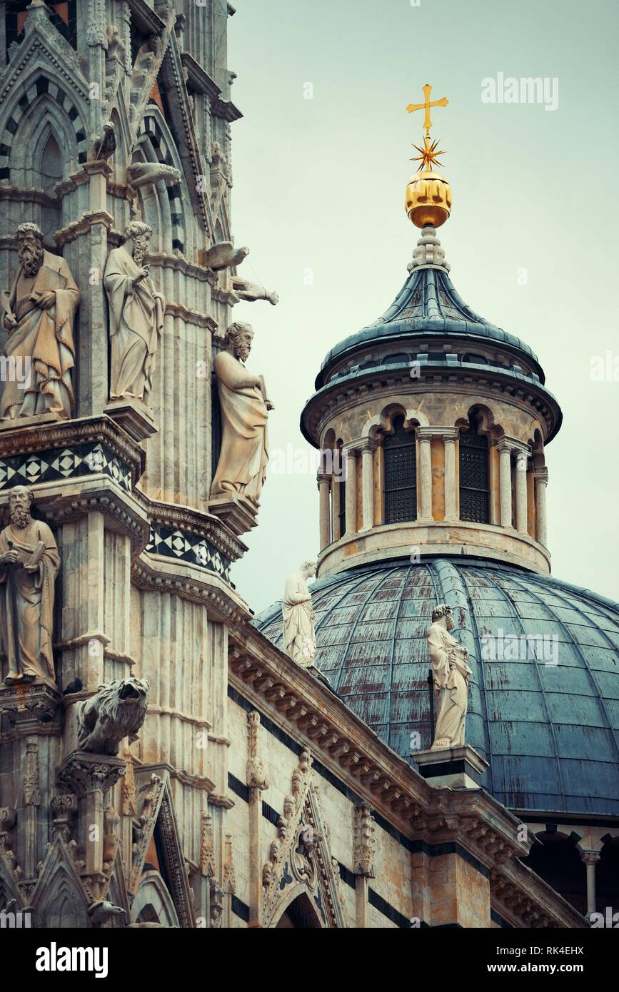Siena Cathedral closeup with dome and statue as the famous landmark in ...