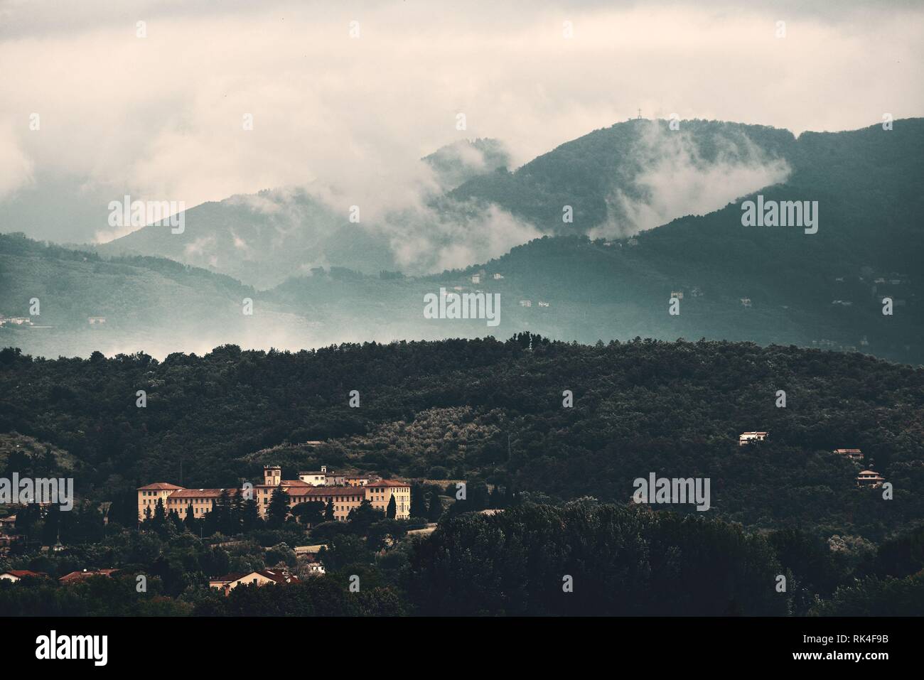 Mountain and cloud after rain in Lucca with historic buildings in Italy ...