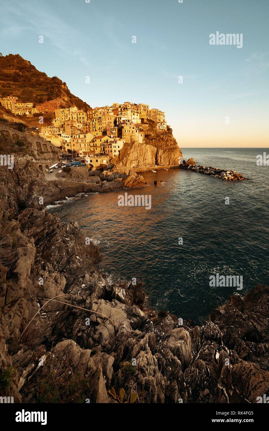 Manarola overlook Mediterranean Sea with buildings over cliff in Cinque ...