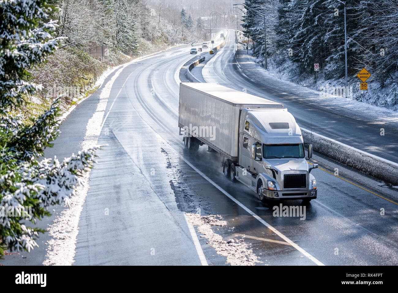 Big rig long haul gray semi truck tractor transporting commercial cargo ...