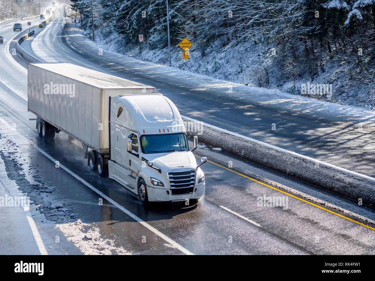 Big rig long haul gray semi truck tractor transporting commercial cargo ...