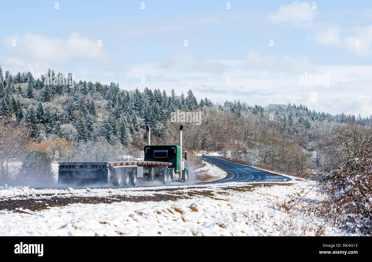 Big rig long haul semi truck tractor transporting empty semi trailer ...