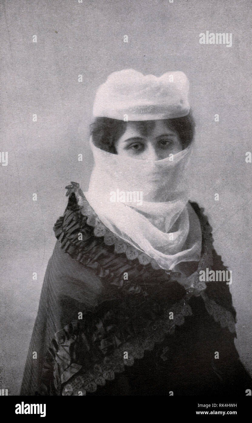 Turkish lady wearing the yashmak and feridje. Photo. Beginning of the ...