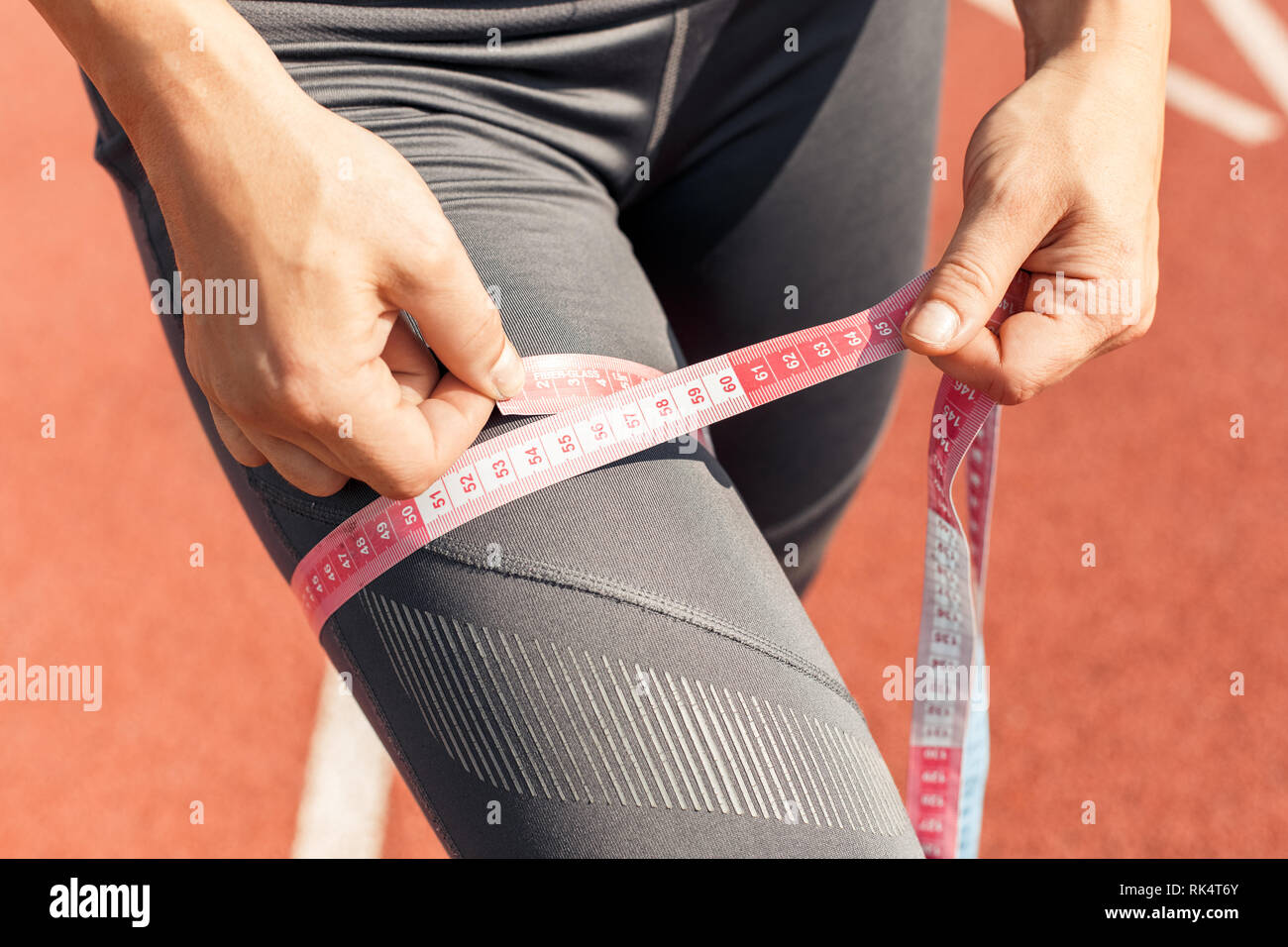 Young woman athlete on stadium sporty lifestyle standing on track ...