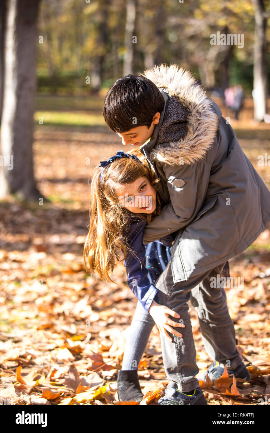 Two brothers playing in the park Stock Photo - Alamy