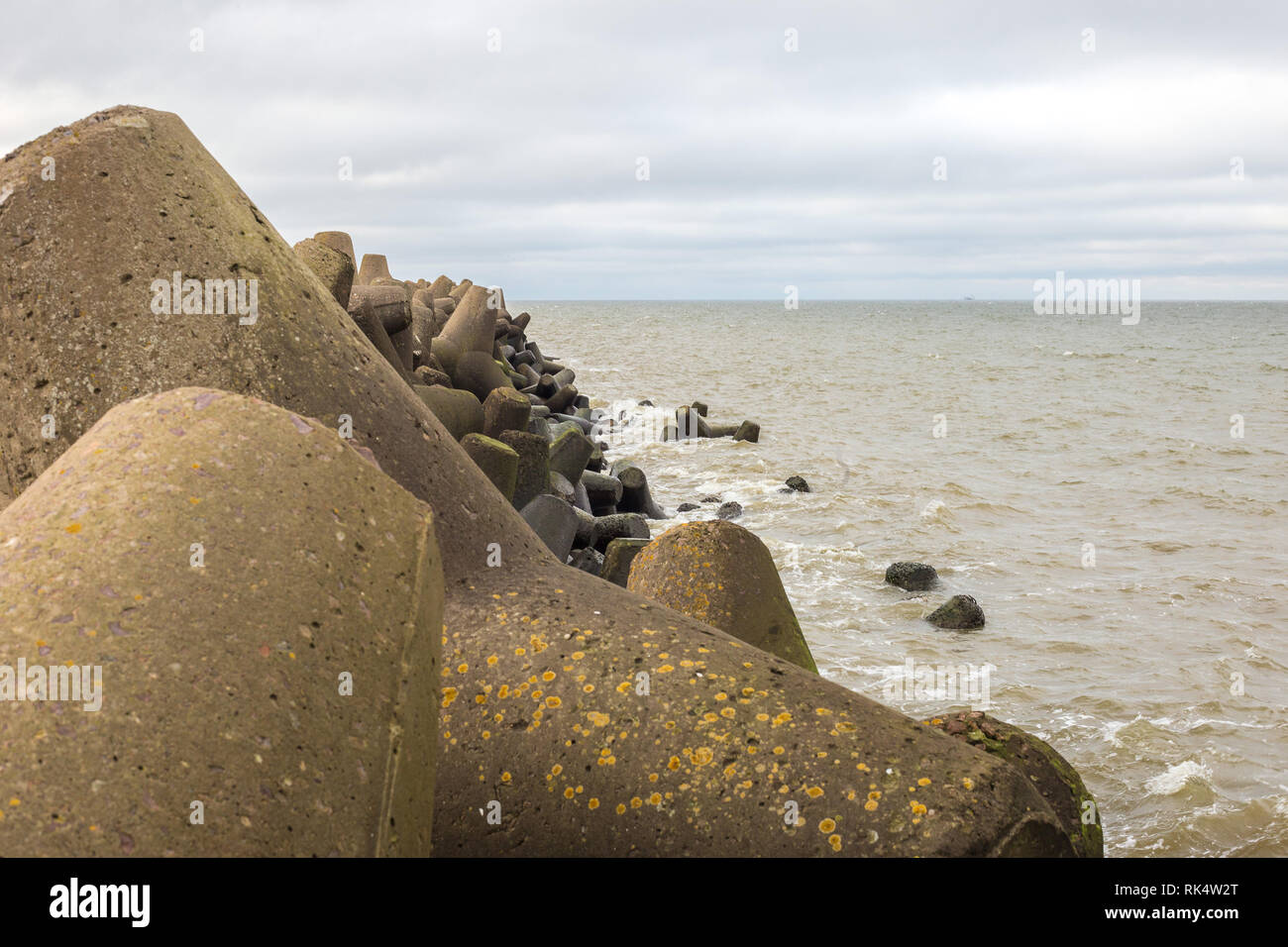 Mole made from huge conical form stone at Liepaja, Latvia Stock Photo ...