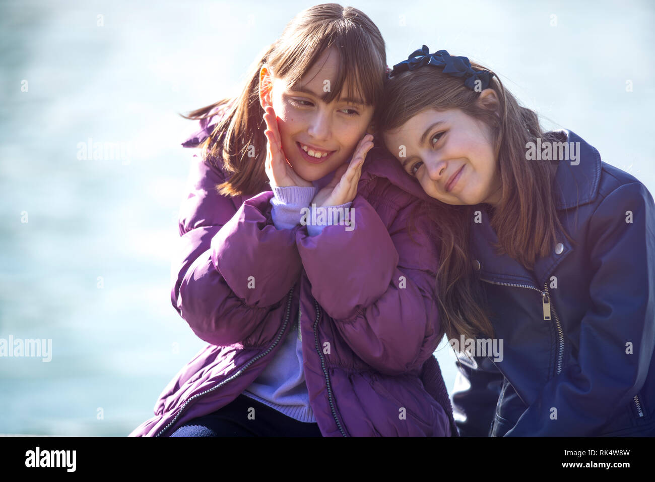 Two girlfriends having fun in a public park in the fall Stock Photo - Alamy