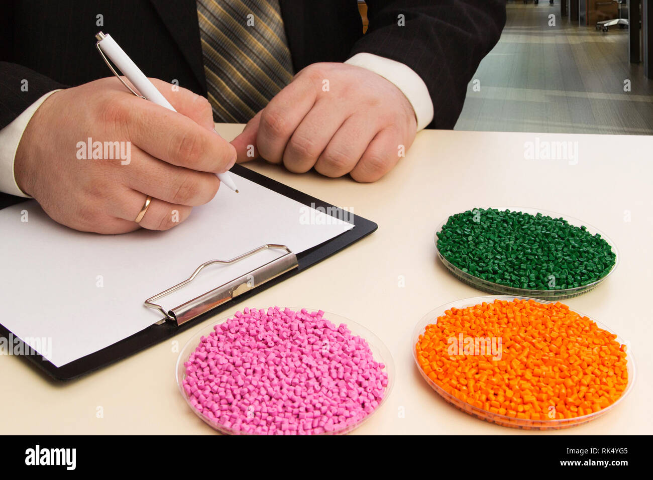 Businessman in the office signs a contract for the supply of plastic ...