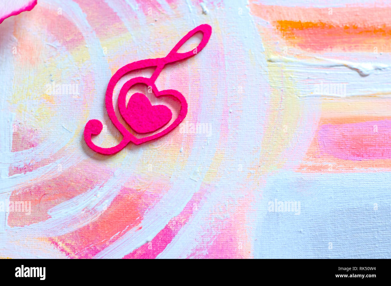 Treble clef with a heart on a beautiful background.Treble clef with a ...