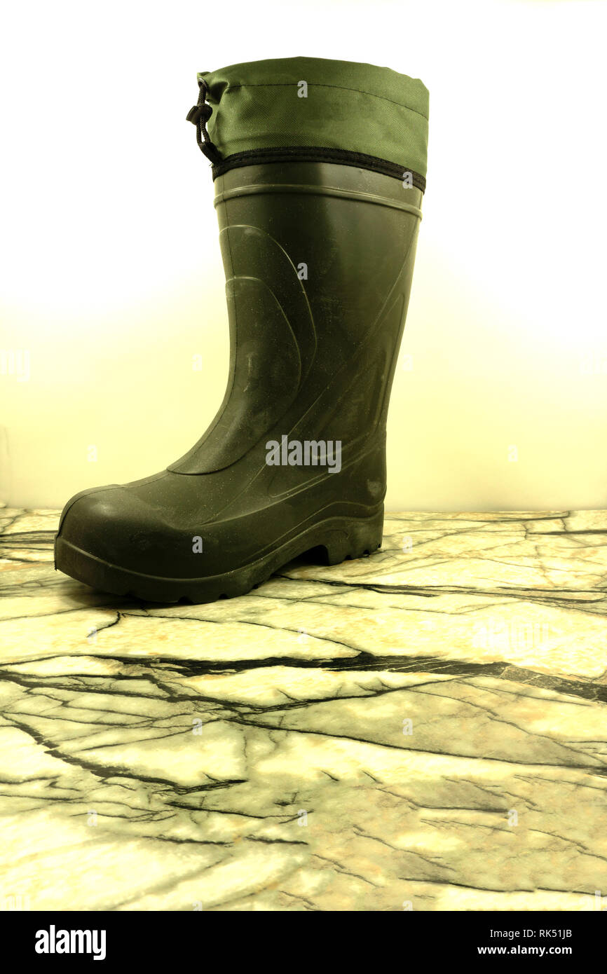 Pair of green rubber boots isolated on white Stock Photo - Alamy