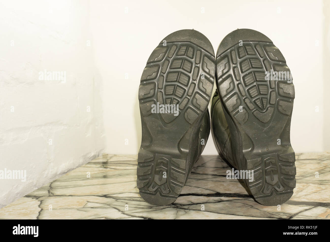 Bottom view of sole of dark blue leather water resistant winter ...