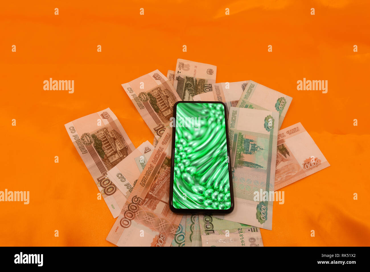 Red diary with stickers on the pages, one hundred dollars banknotes ...