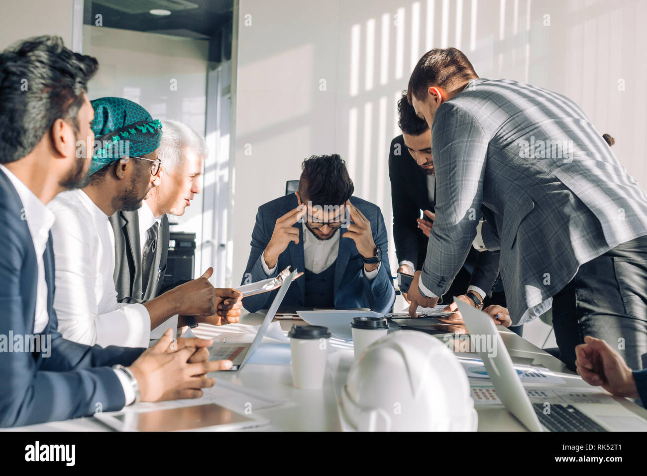 Conflict on business meeting with team. Young male Chief Executive ...