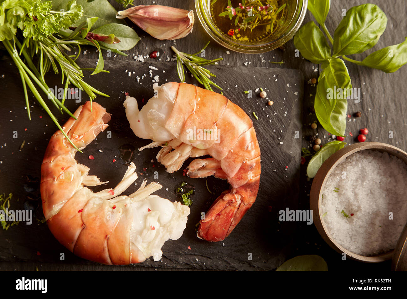 Fresh prawn tails with herbs and salt ready to prepare a gourmet ...