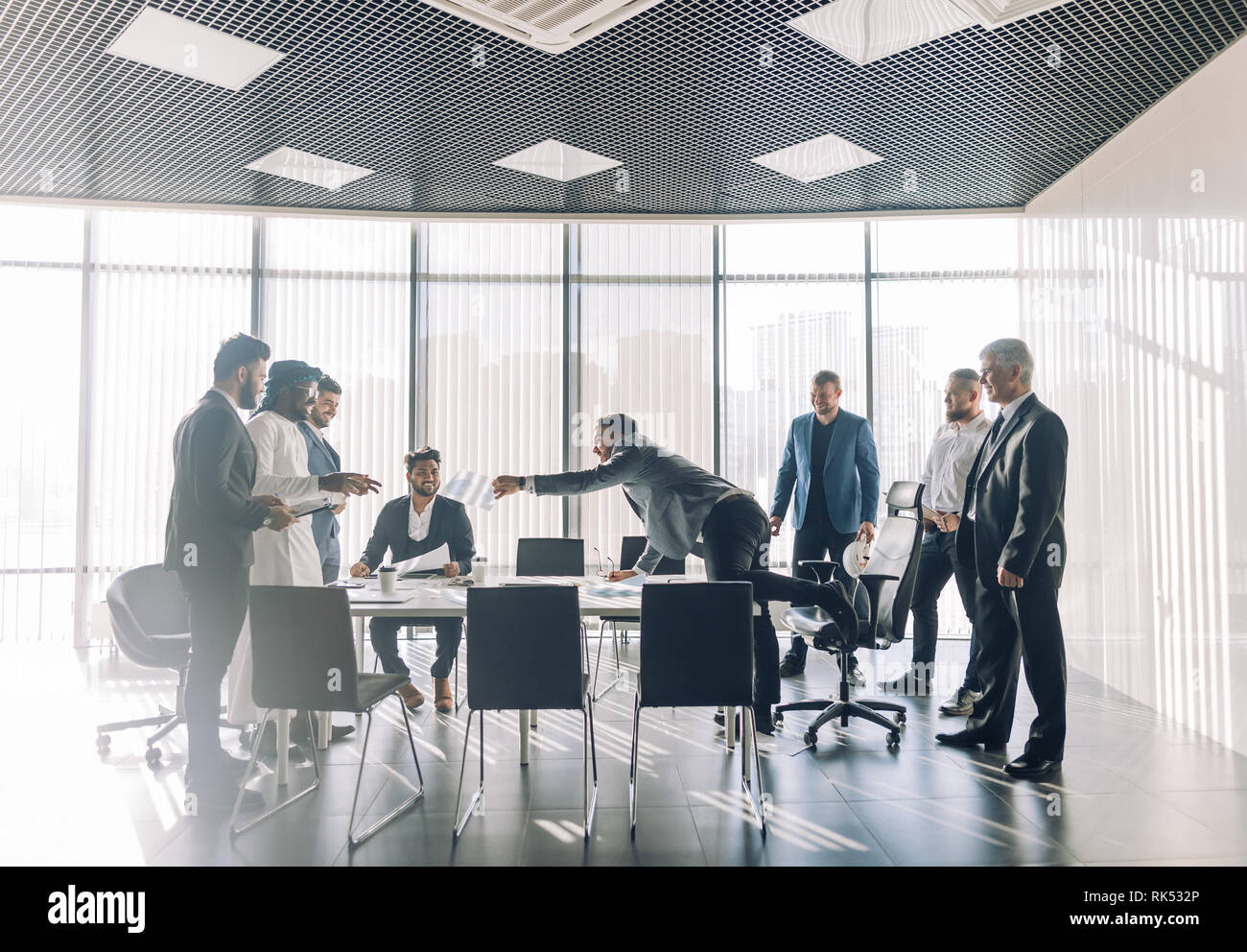 Multiracial male partners dispute at negotiations, having fun while ...