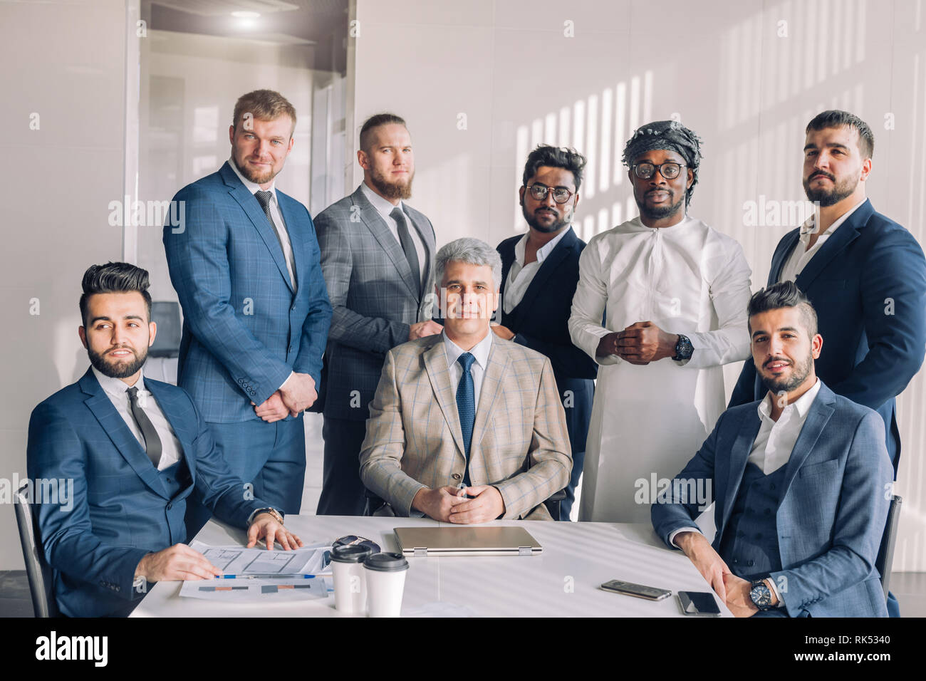 Business men gather hi-res stock photography and images - Alamy