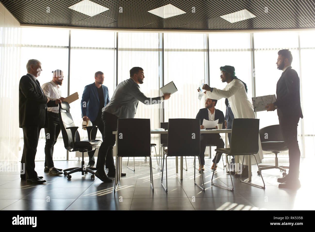 mixed race business partners arguing about bad contract. , investors ...