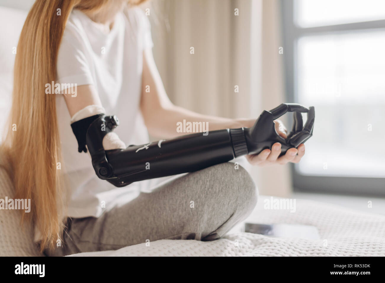 woman's hands holding artificial arm. close up cropped photo.health and ...
