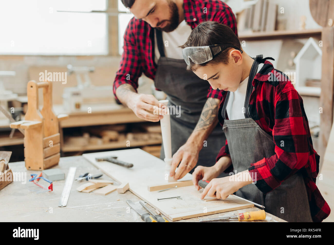 Hardworking caucasian junior school age boy holding ruler and making ...