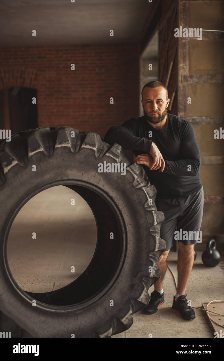 Professional CrossFit trainer explains principles of training with tire ...