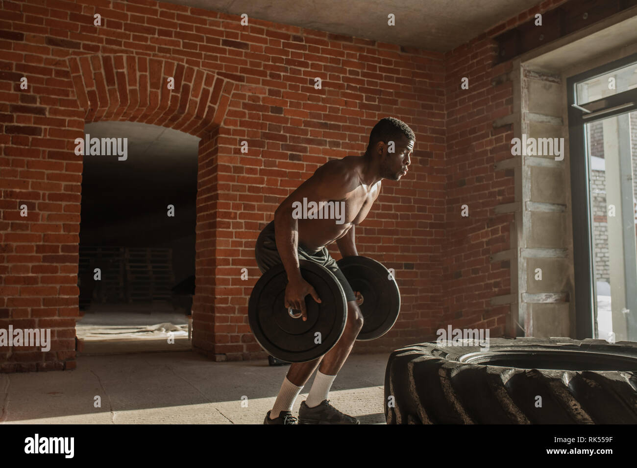 Powerful strong african fighter boxer practicing Weighted Jumps with ...