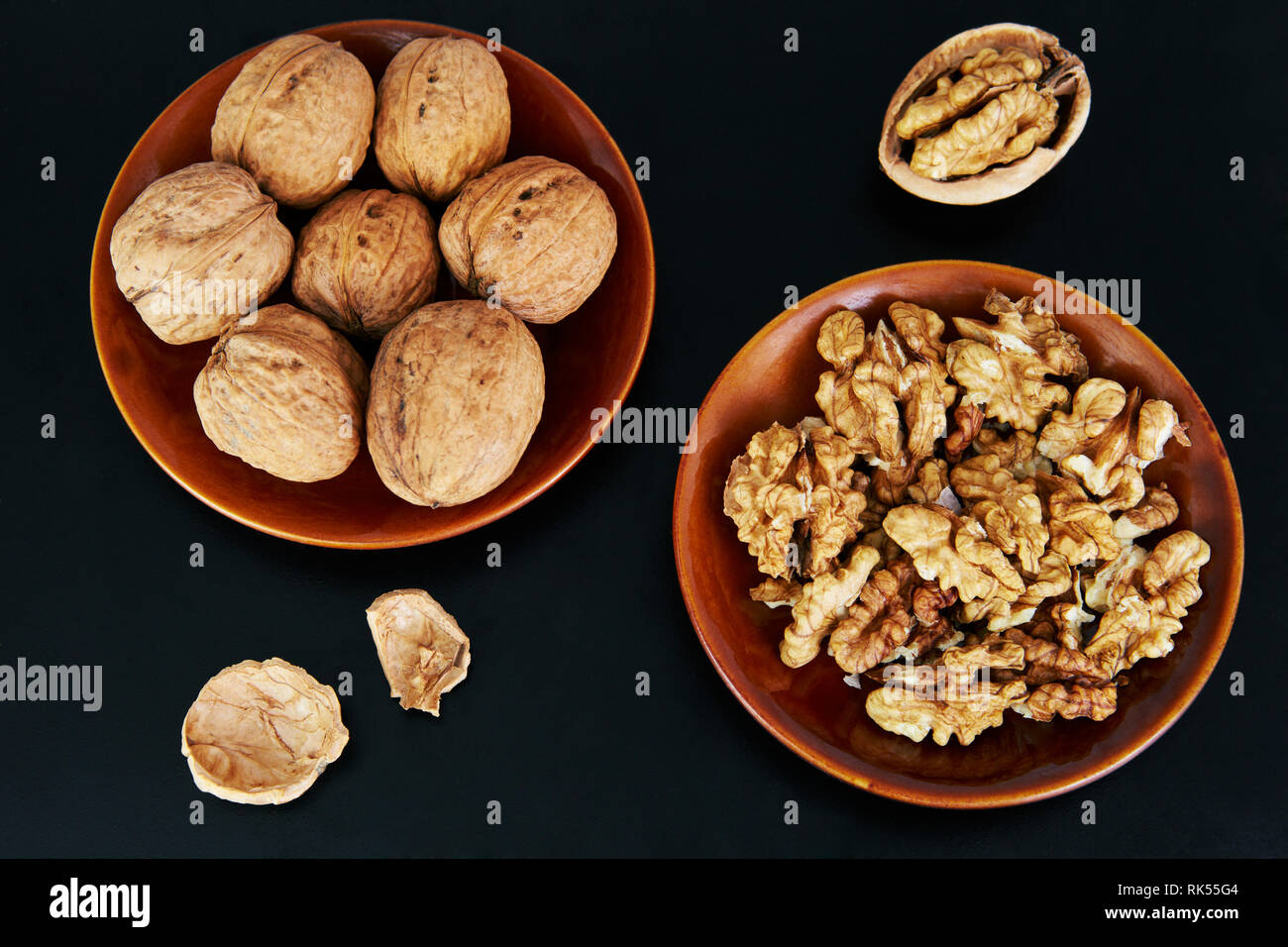 Greek walnuts on a black background, lie in a beautiful bowl Stock ...