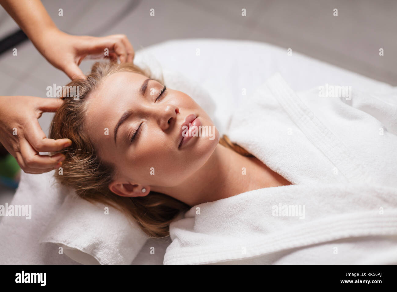 good looking girl with closed eyes wants to brighten her skin and make ...