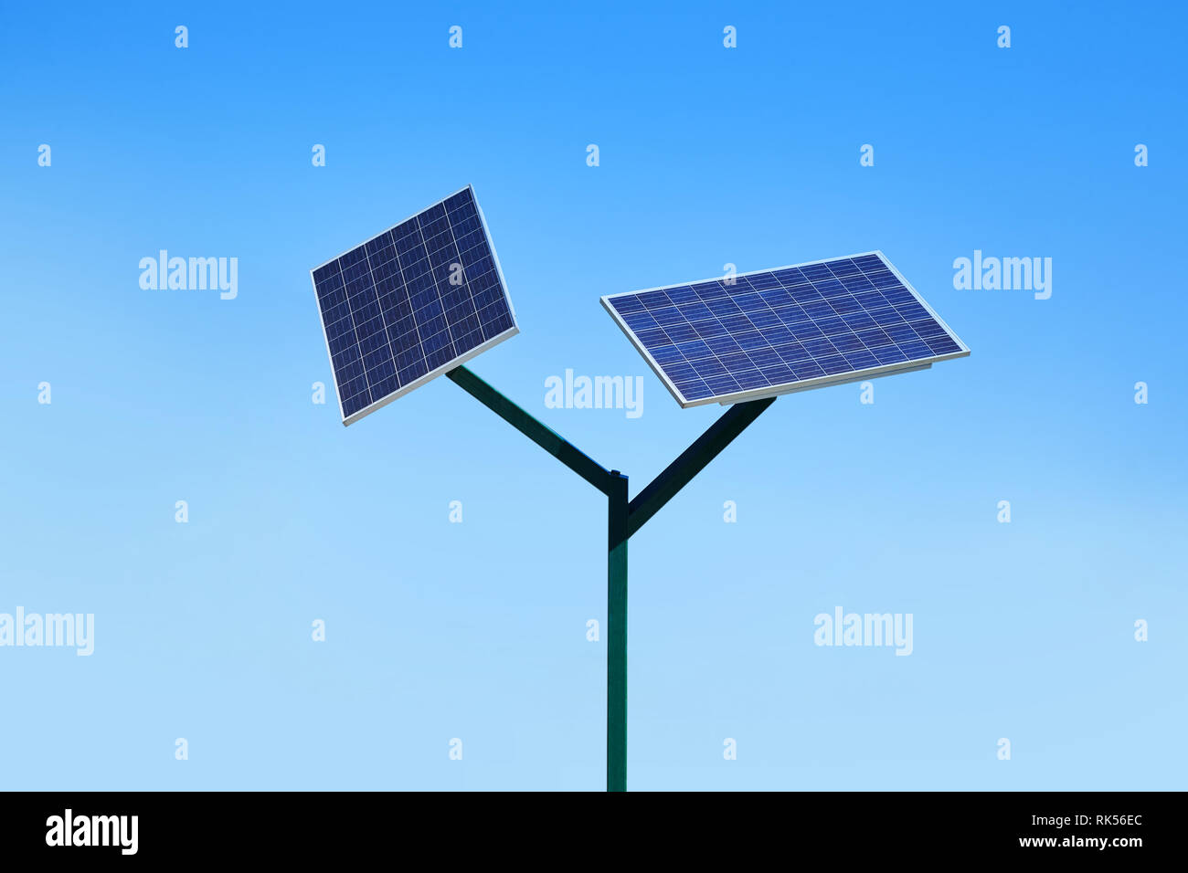 Solar battery on blue sky background Stock Photo - Alamy
