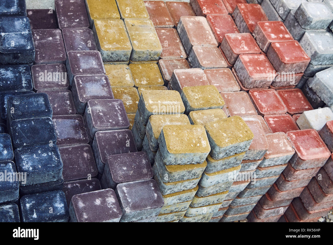 pile of colored concrete paving slab close up Stock Photo - Alamy