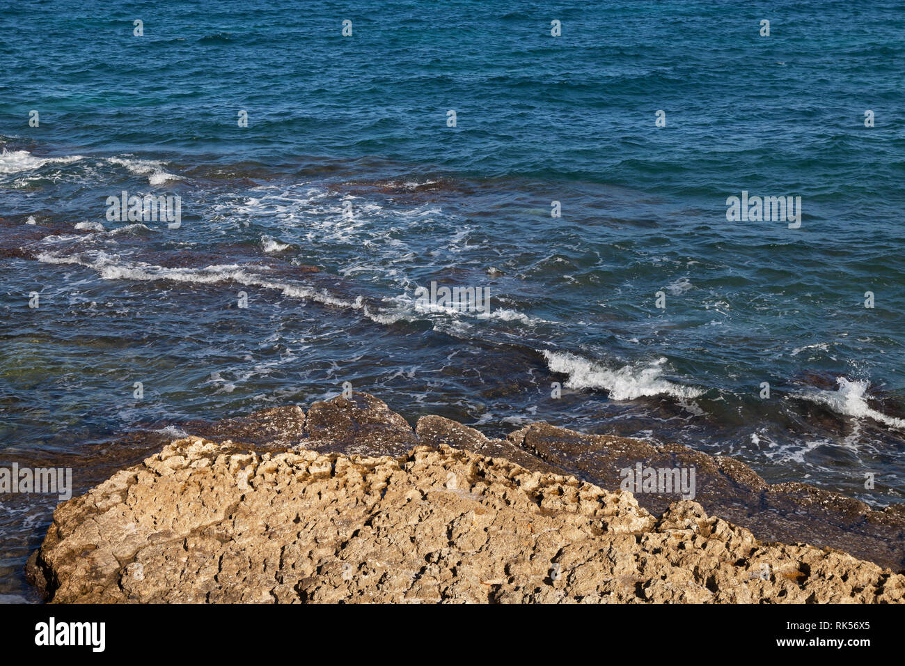 Water splash on rocky coastline Stock Photo - Alamy
