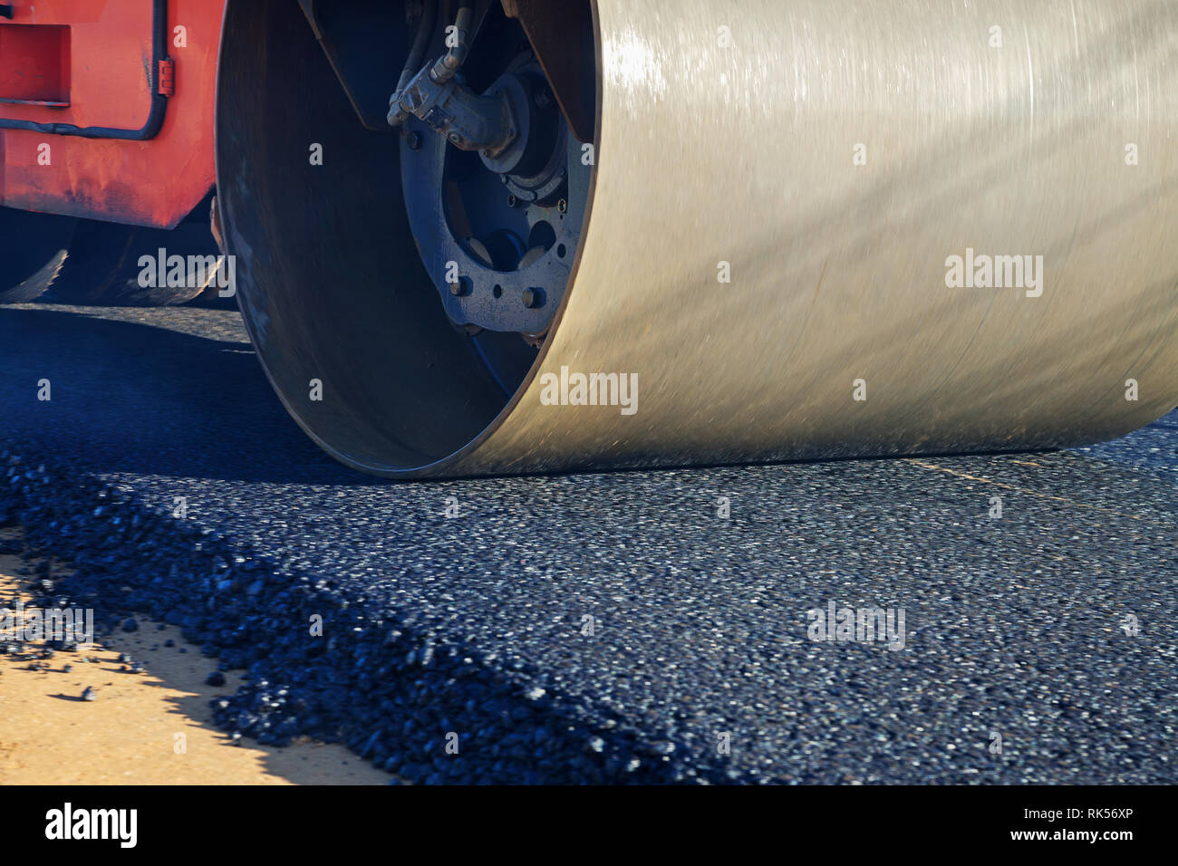 Works with steamroller machine Stock Photo - Alamy
