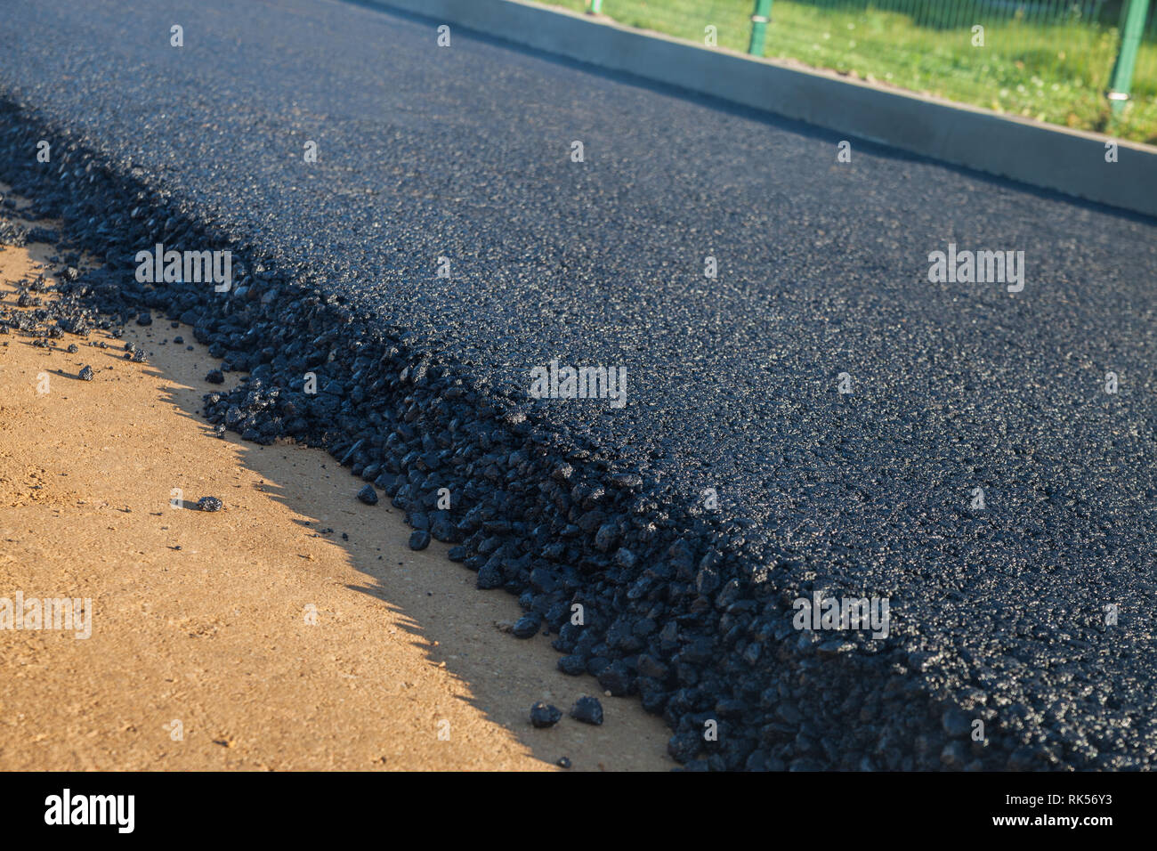 Detail of the new asphalt road Stock Photo - Alamy