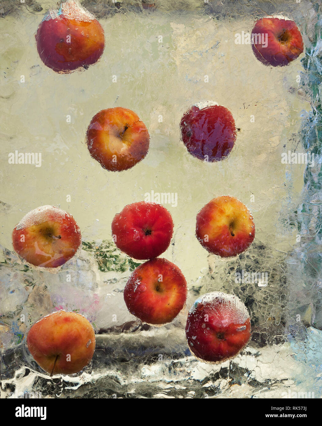 Apples are frozen in ice Stock Photo - Alamy