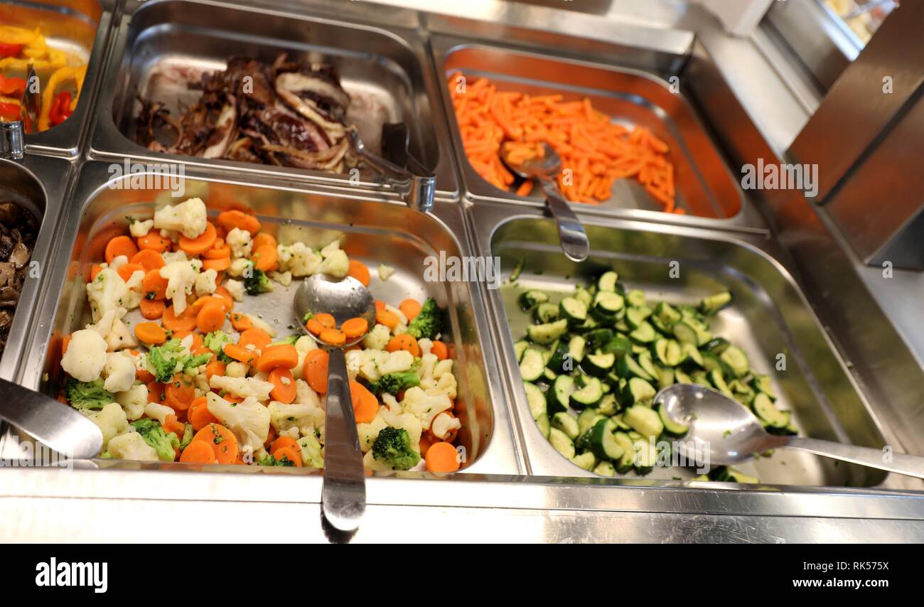 Inside a self service restaurant with many raw and cooked foods Stock ...
